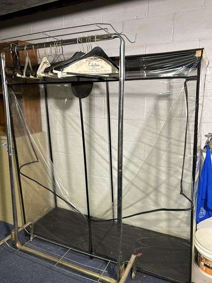 Enclosed Wardrobe and clothes rack with hangers - Kaufman Realty & Auctions