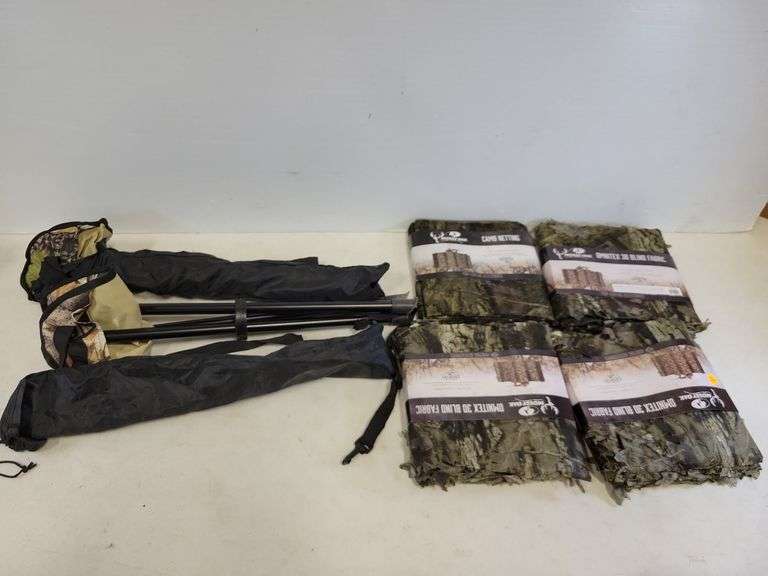 Camo Netting and Line Fabric with Tripod Chairs - Kaufman Realty & Auctions