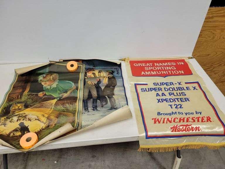Vintage posters & Winchester banner - Kaufman Realty & Auctions