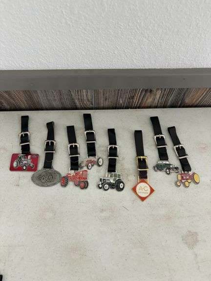 8- Tractor Watch fobs - Kaufman Realty & Auctions