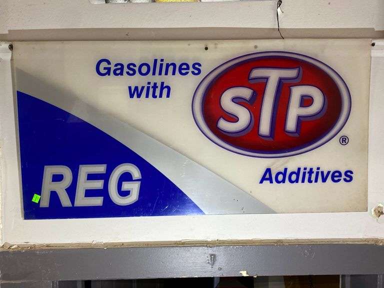 “STP GASOLINE” Sign - Kaufman Realty & Auctions