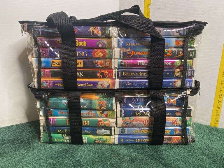 2 Cases Of Disney VHS’s - Kaufman Realty & Auctions