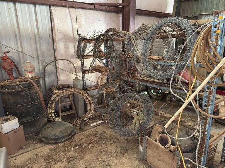 Assortment Of Barb Wire, 50 Gal Drum, Electrical Wire, Metal Rack And ...