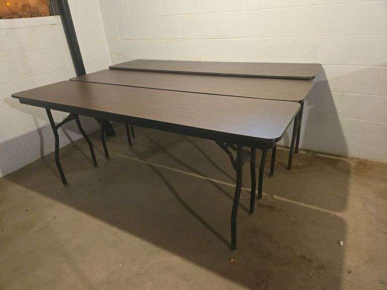 (3) brown folding tables- 18"x72" - Kaufman Realty & Auctions