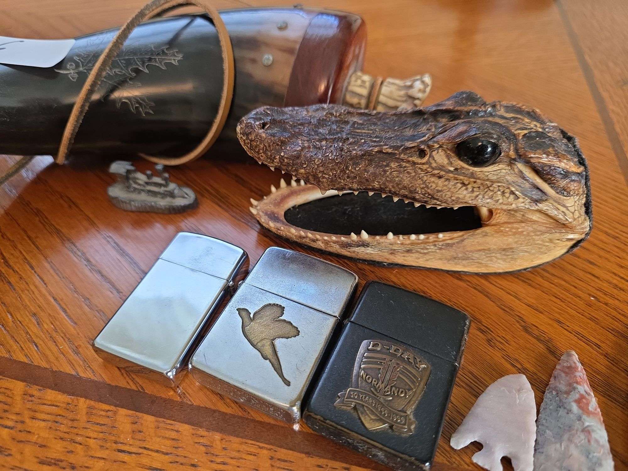 Powder horn, gator head, lighters & arrowheads - Kaufman Realty & Auctions