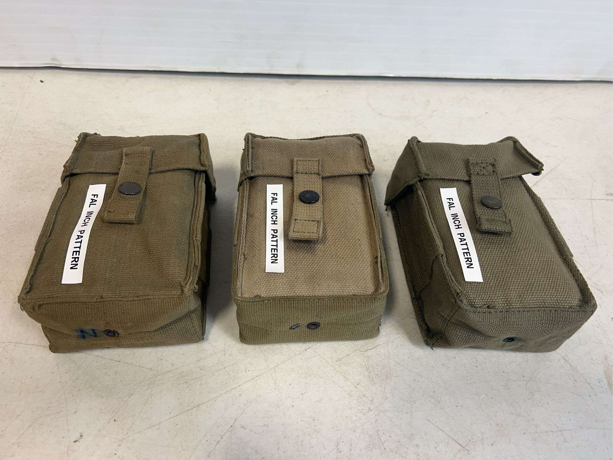 (3) sets of FAL mags with pouches - Kaufman Realty & Auctions
