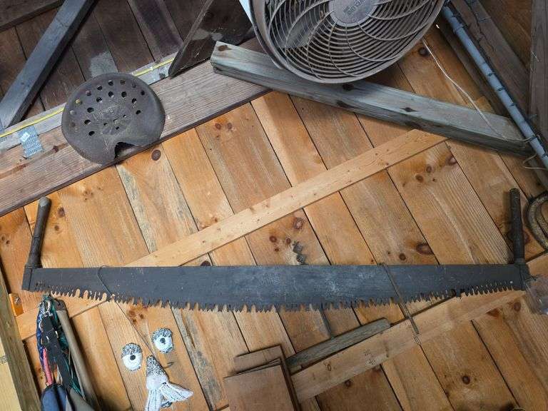 2 man crosscut saw & tractor seat - Kaufman Realty & Auctions