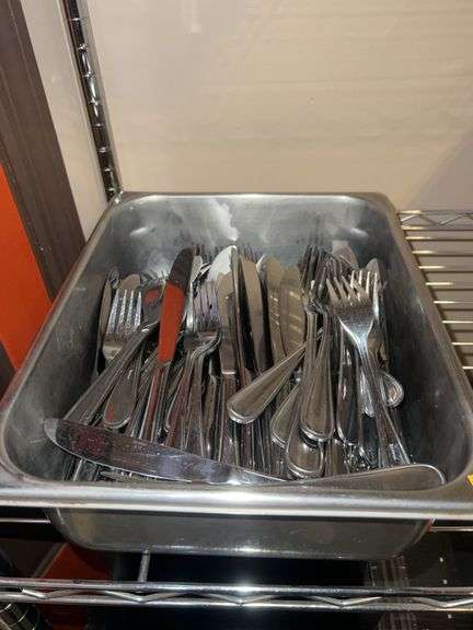 Assortment of Silverware in Stainless Steel Pan - Kaufman Realty & Auctions