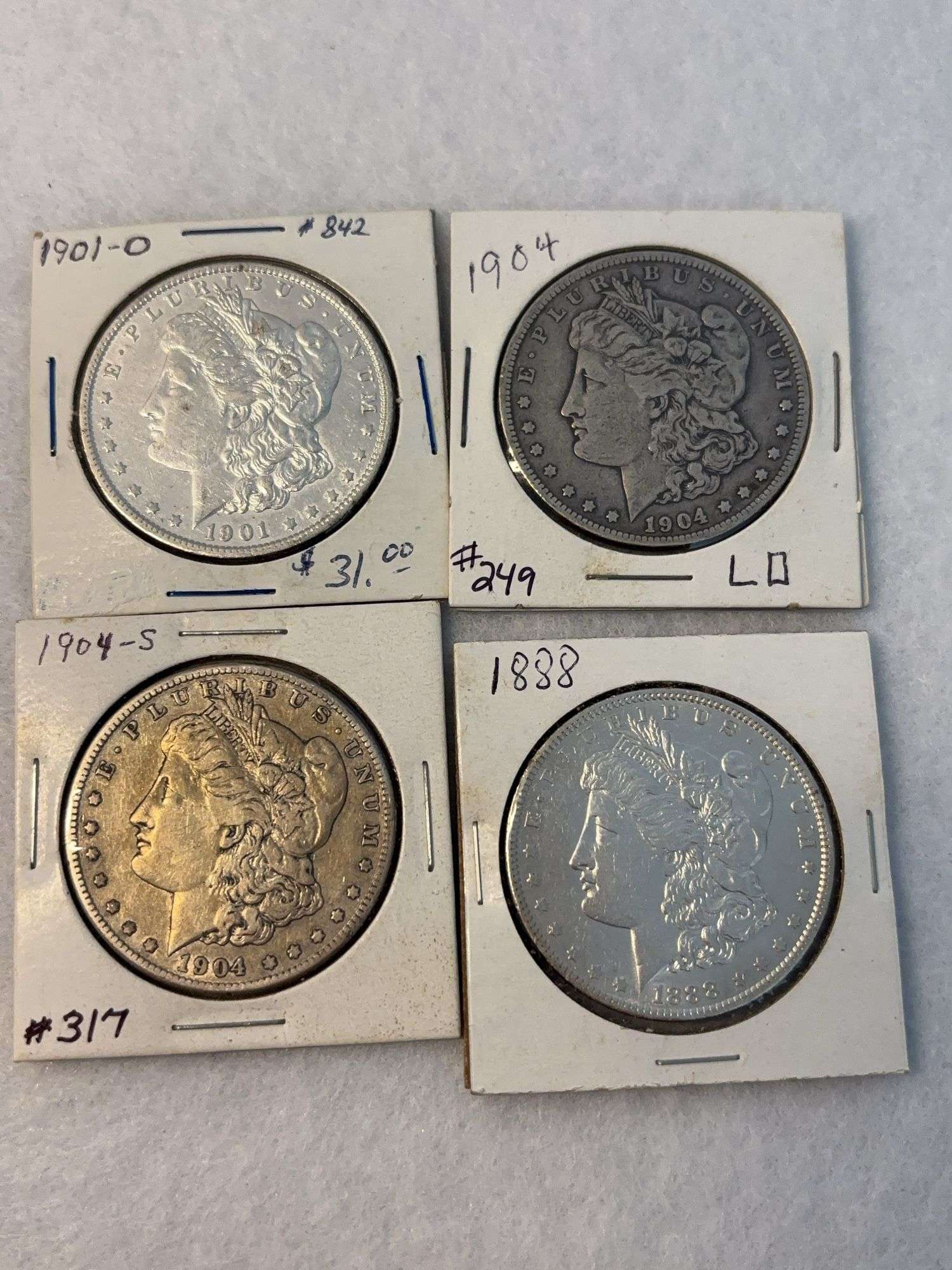 4 Morgan Dollars - Kaufman Realty & Auctions