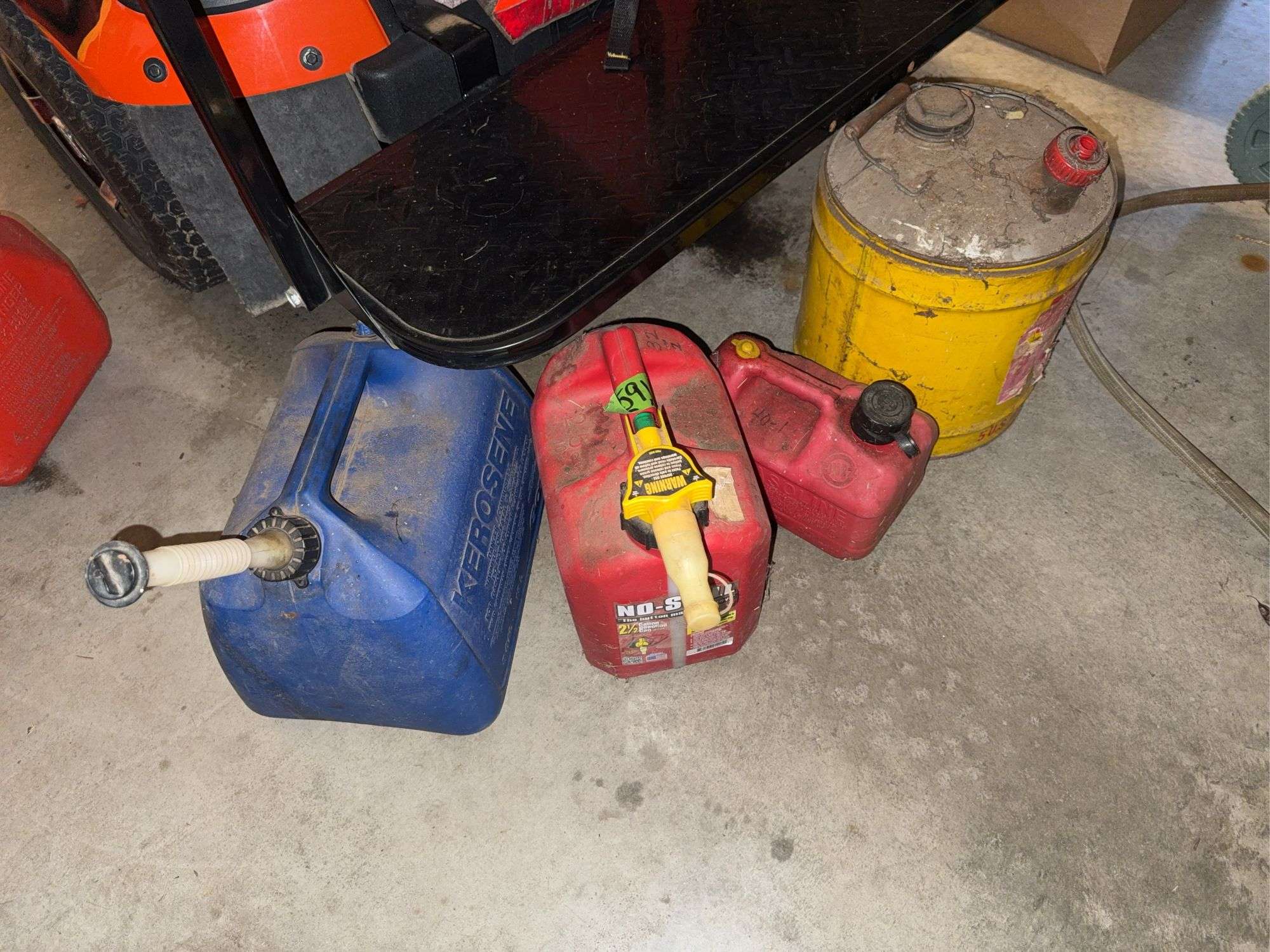 4- GAS CANS- 1 METAL SHELL CAN - Kaufman Realty & Auctions