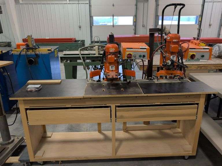 Blum mini press MSP boring and insertion machine on workbench - 7’ long ...