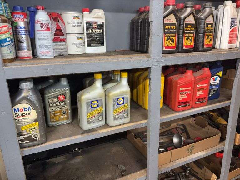 Contents of shelf including Synthetic motor oil & transmission fluid ...