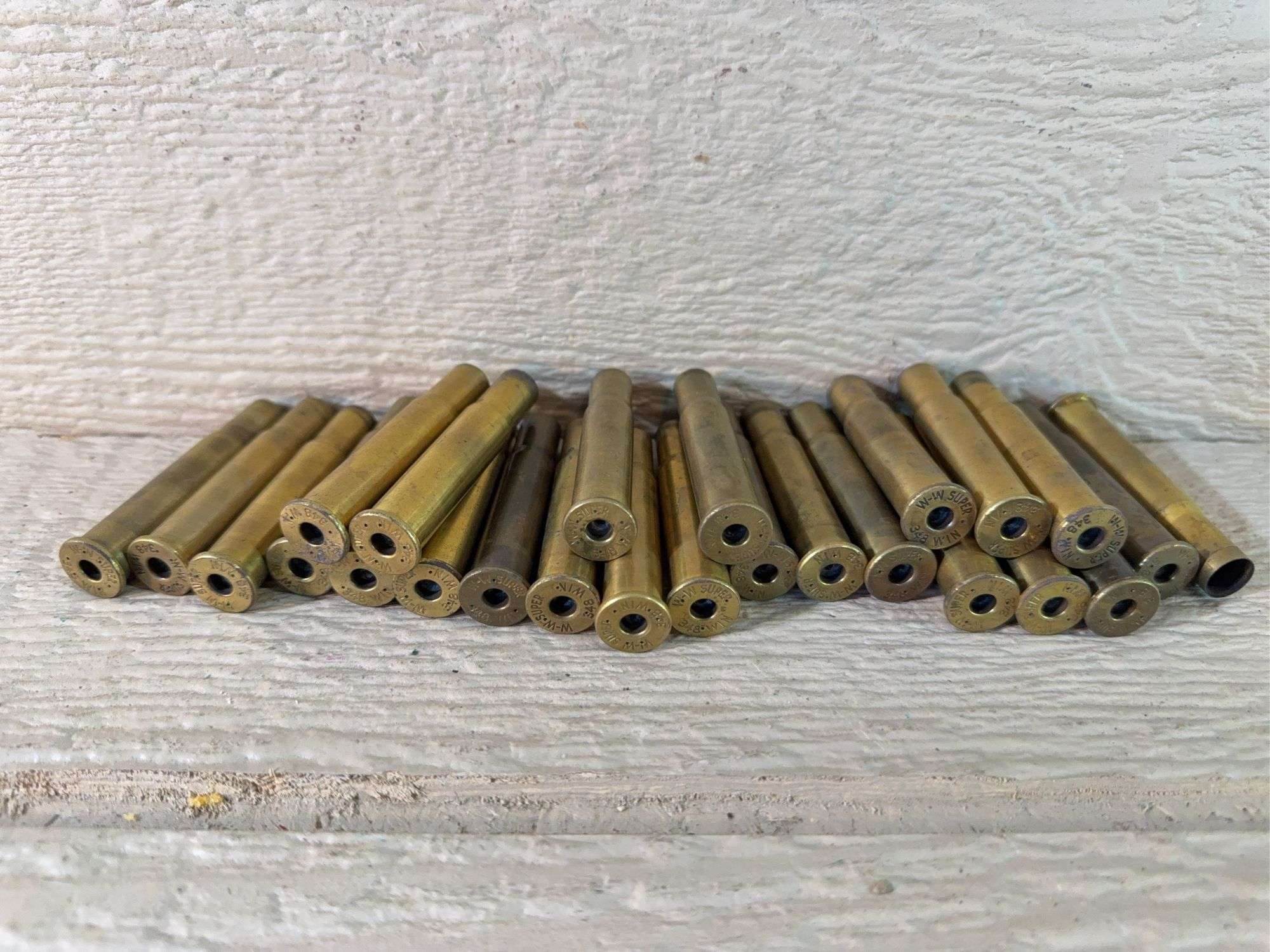 .348 WIN BRASS - 25 PIECES - Kaufman Realty & Auctions