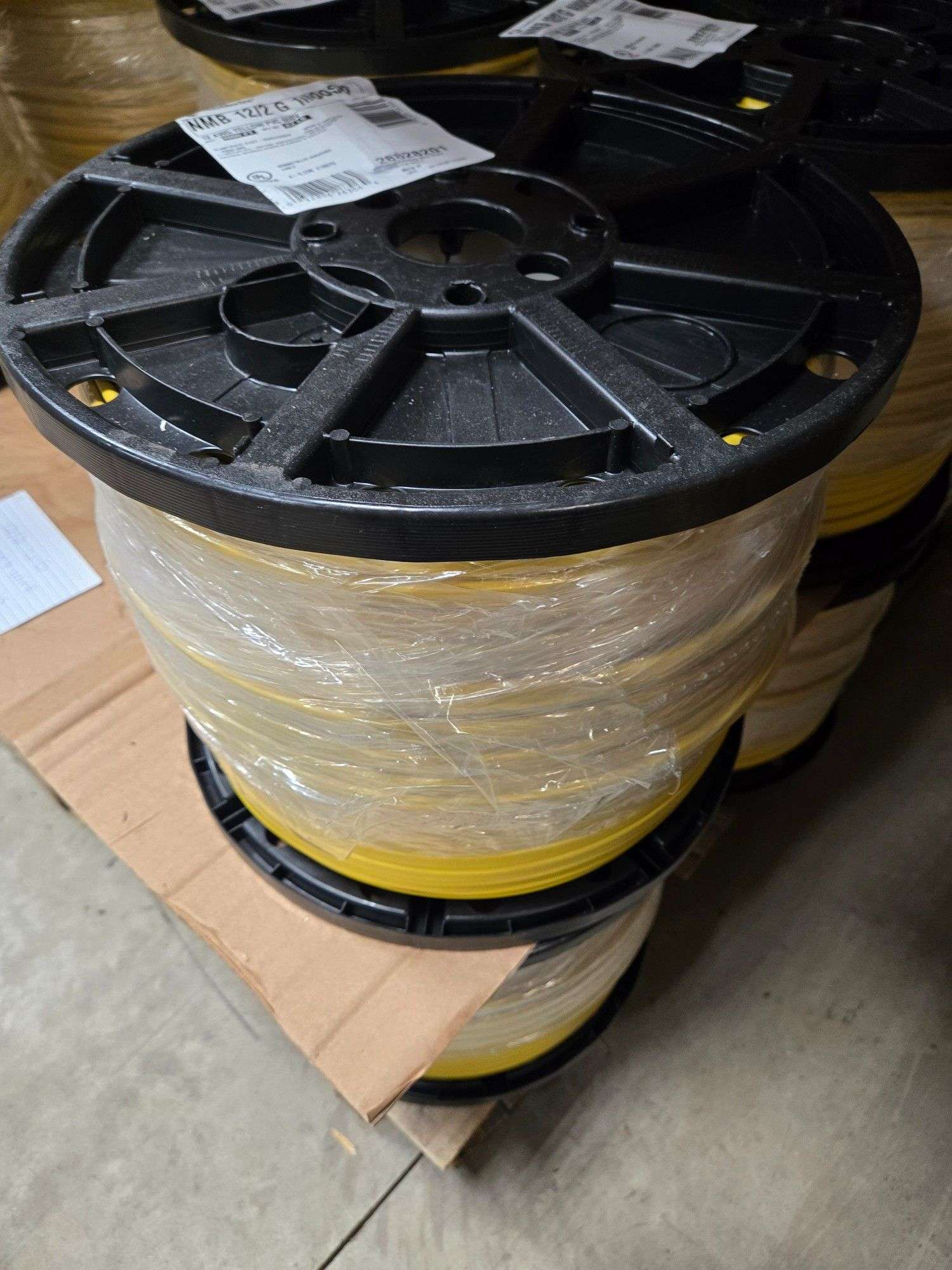 (2) 1000' 12/2 WG Romex wire spools - Kaufman Realty & Auctions
