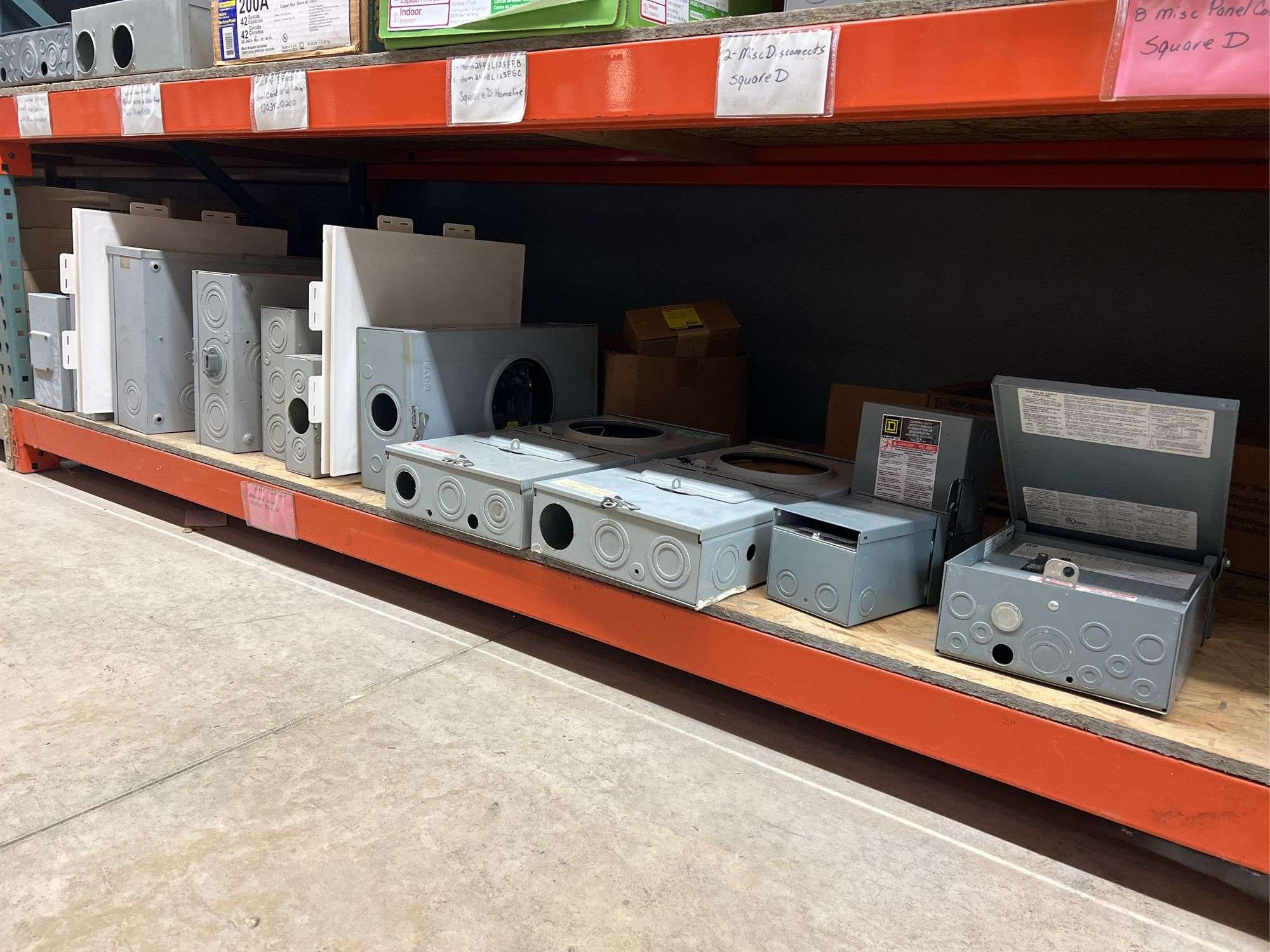 Shelf w/ misc meter bases- includes used & new - Kaufman Realty & Auctions