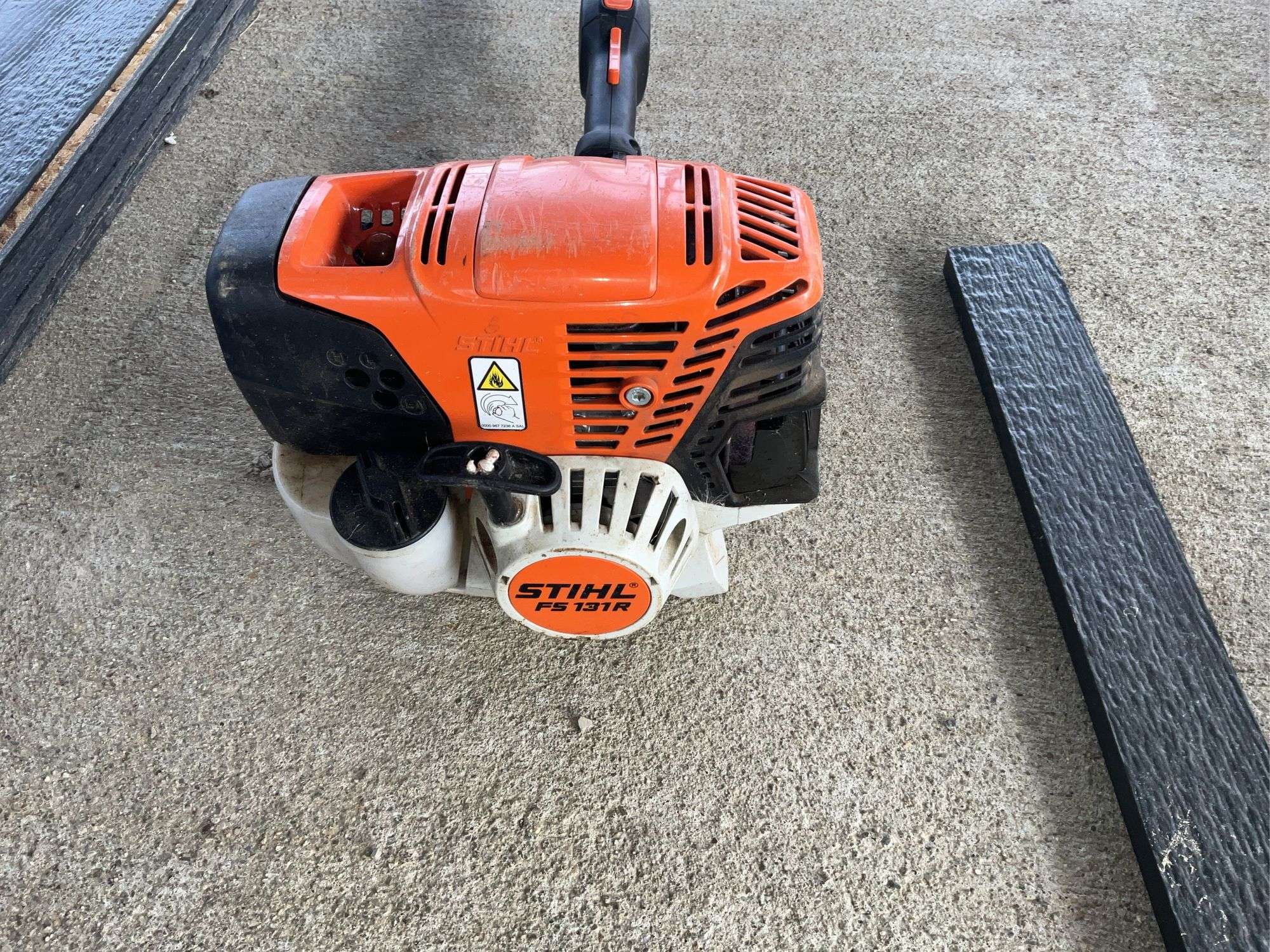 Stihl FS131R weed eater - Kaufman Realty & Auctions