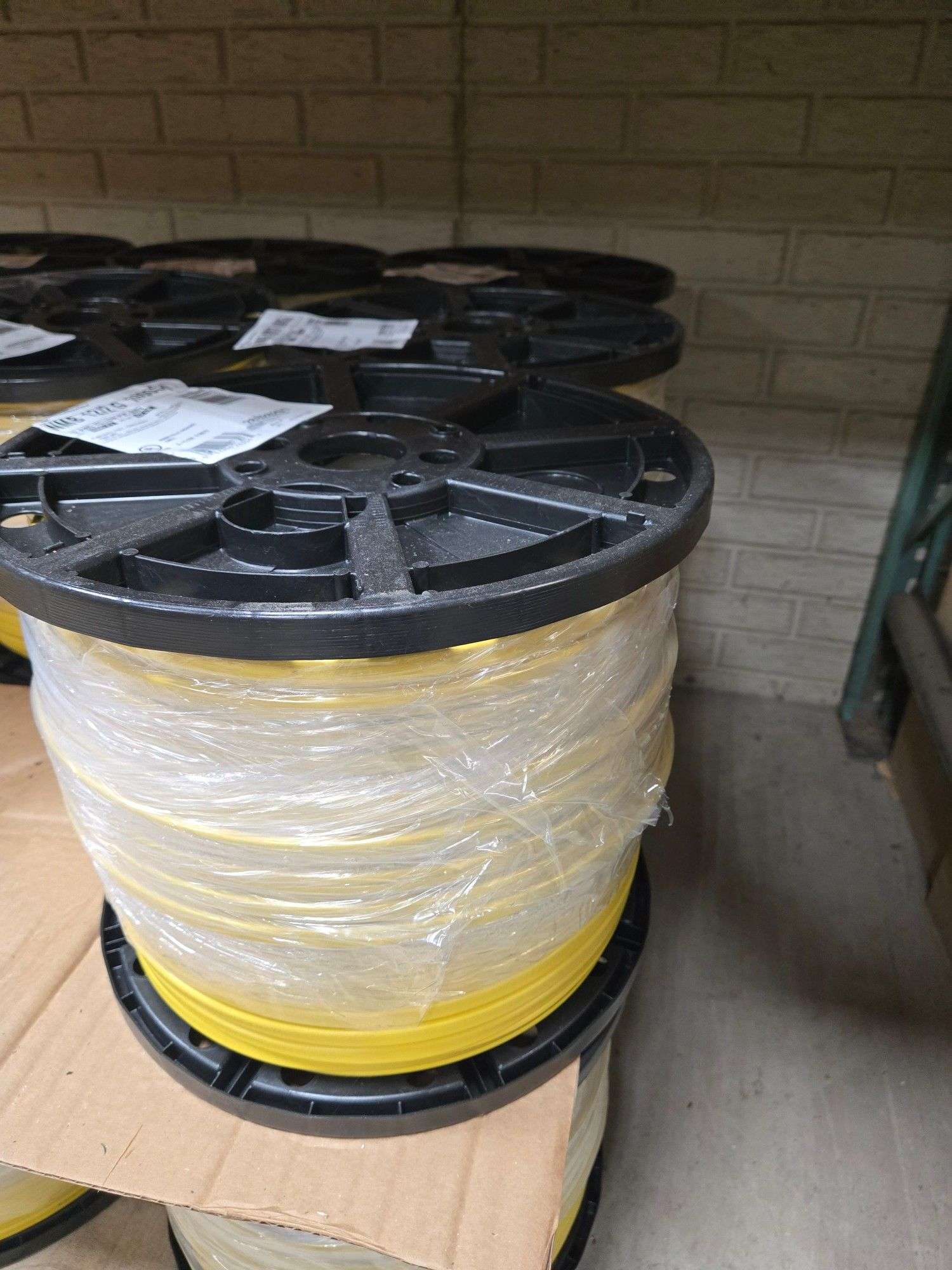 (2) 1000' 12/2 WG Romex wire spools - Kaufman Realty & Auctions