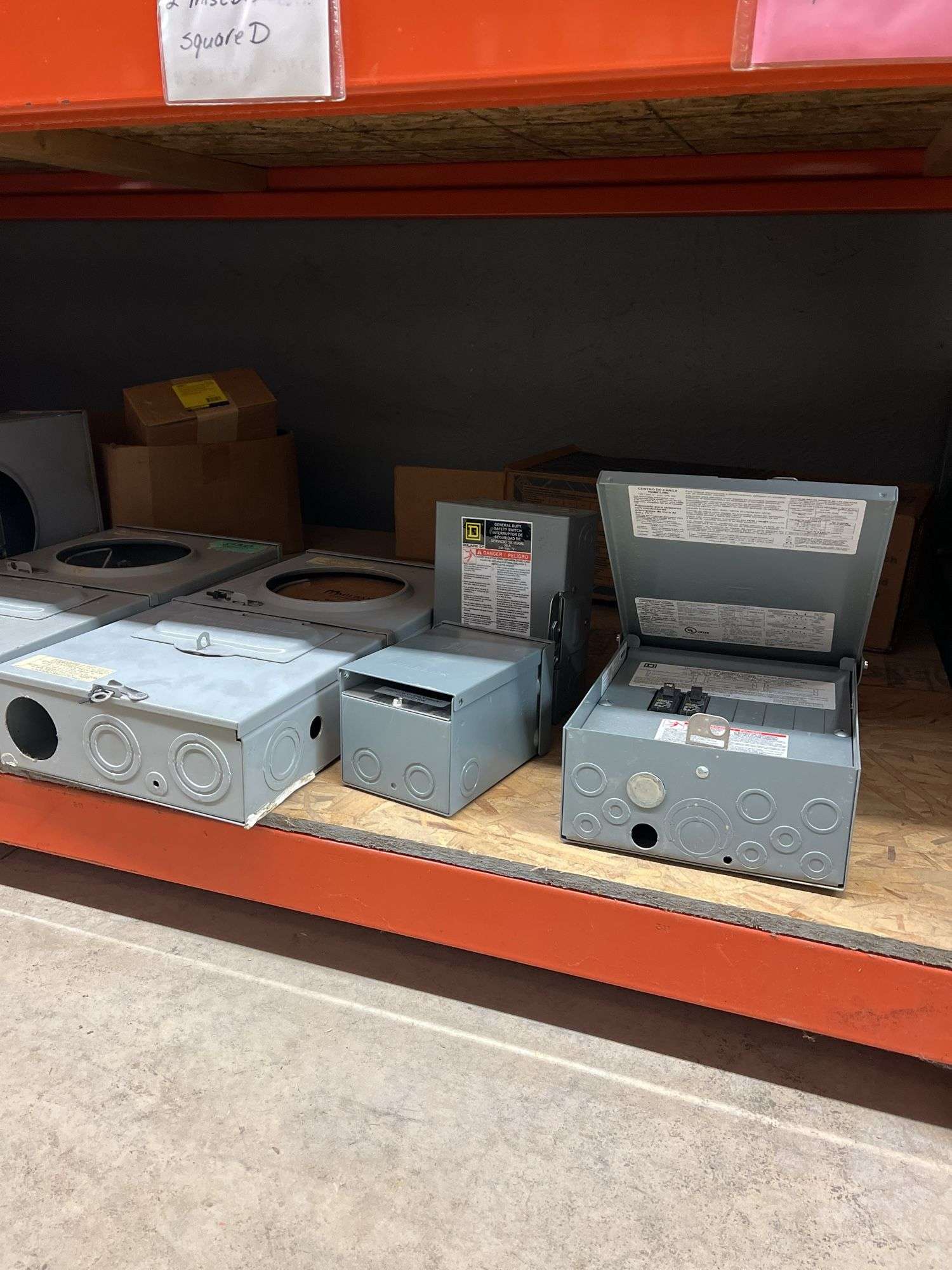 Shelf w/ misc meter bases- includes used & new - Kaufman Realty & Auctions