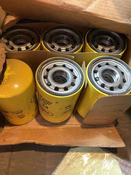 Assortment of CAT Oil Filters - Kaufman Realty & Auctions
