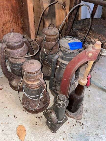 Four oil lamps, jack, and antique bottle capper - Kaufman Realty & Auctions