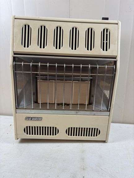 Glo-Warm wall mount propane heater (new) - Kaufman Realty & Auctions