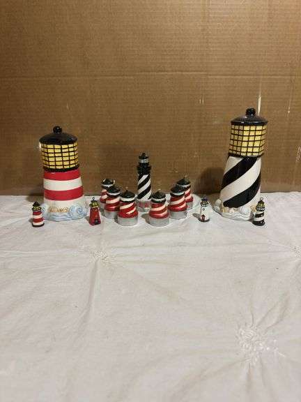 VARIETY OF LIGHTHOUSE SCULPTURES WITH CANDLES - Kaufman Realty & Auctions