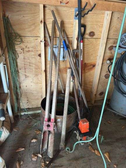 Hand tools, garden hose bucket, post hole digger, rakes, shovels ...