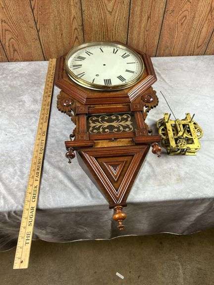 Unmarked assortment of clock parts including case, multiple watch faces ...