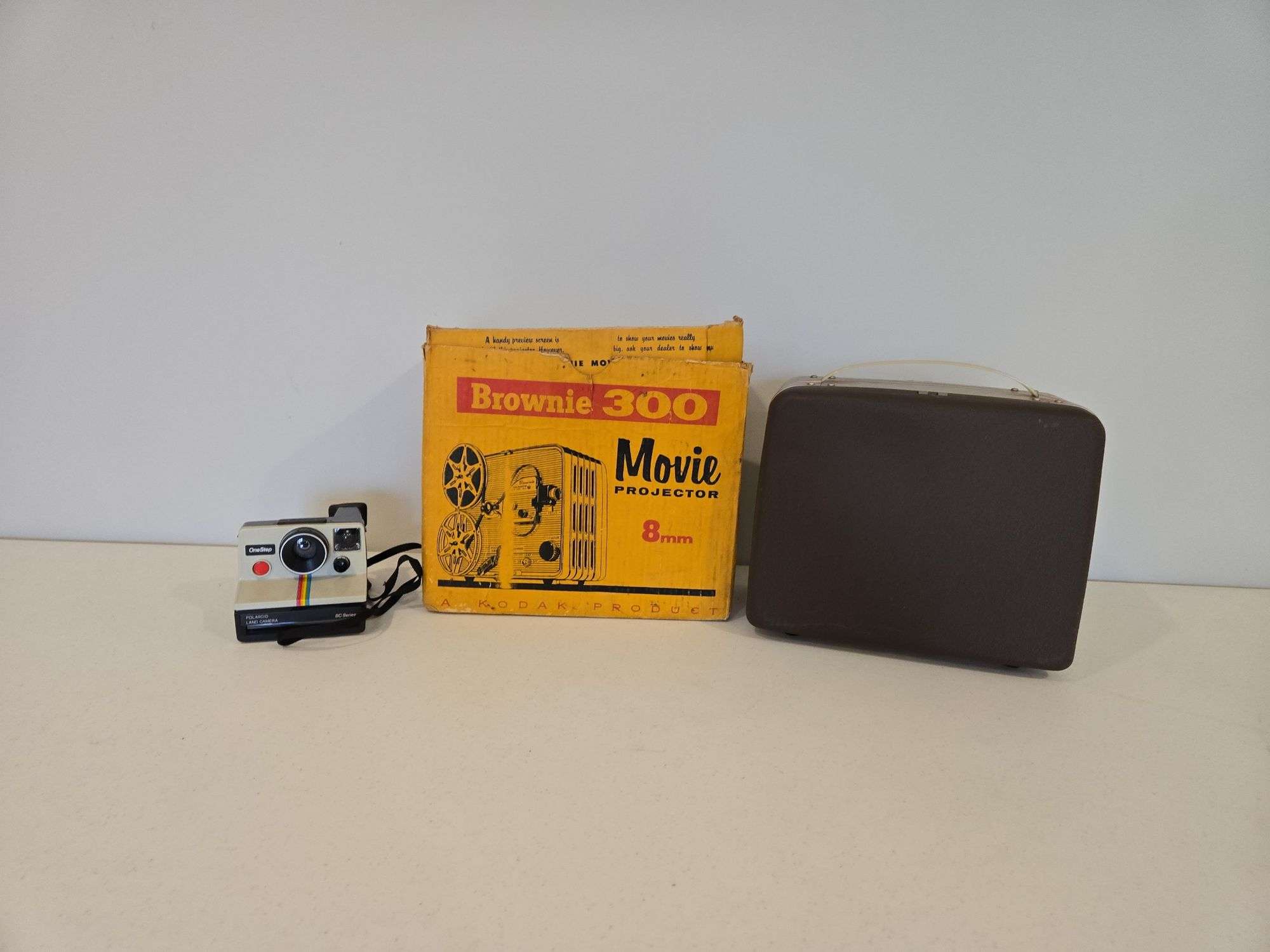 Vintage Polaroid camera & Kodak Brownie 300 projector - Kaufman Realty ...