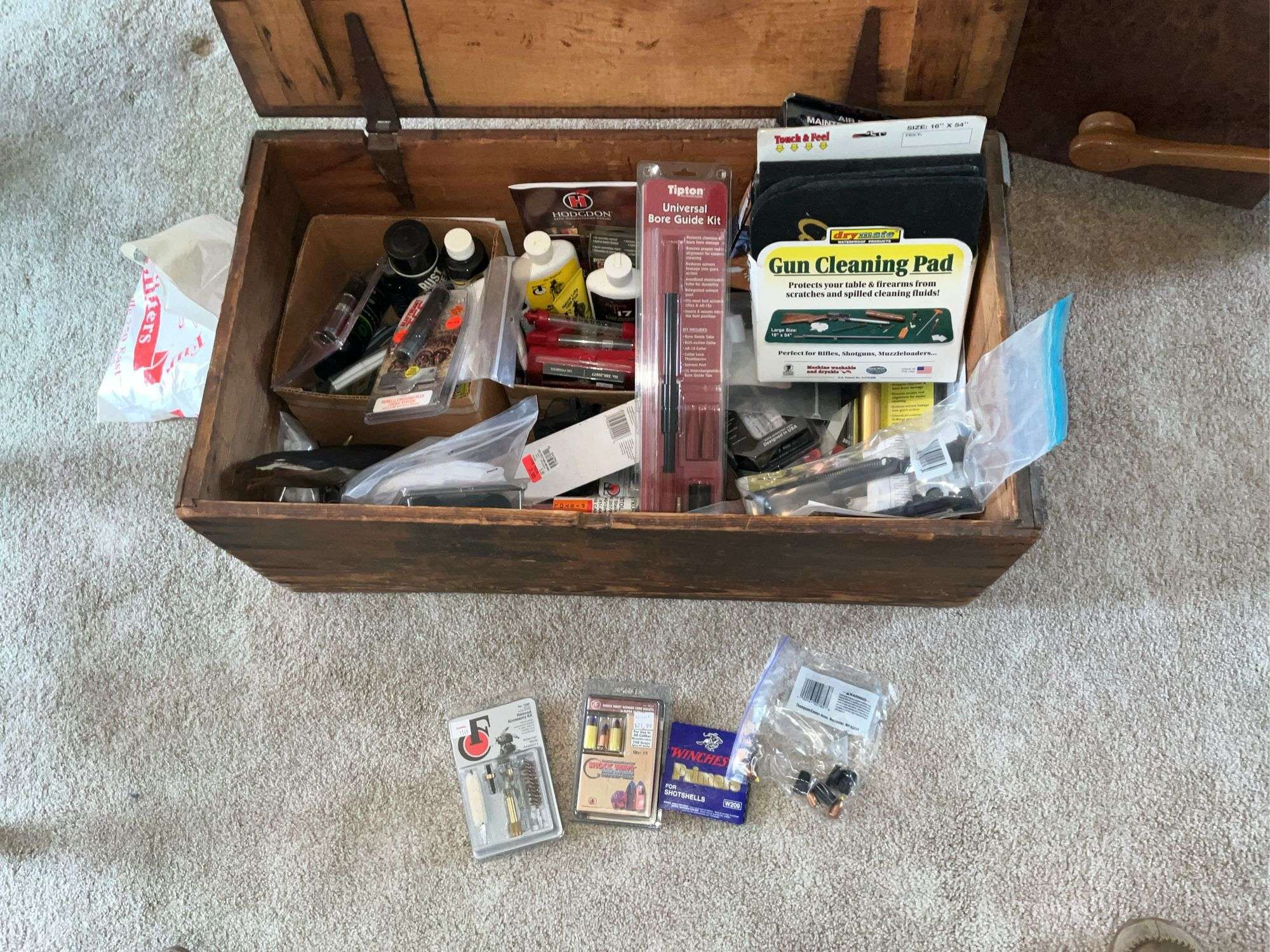 Box loaded with muzzleloader, accessories, and gun cleaning items ...