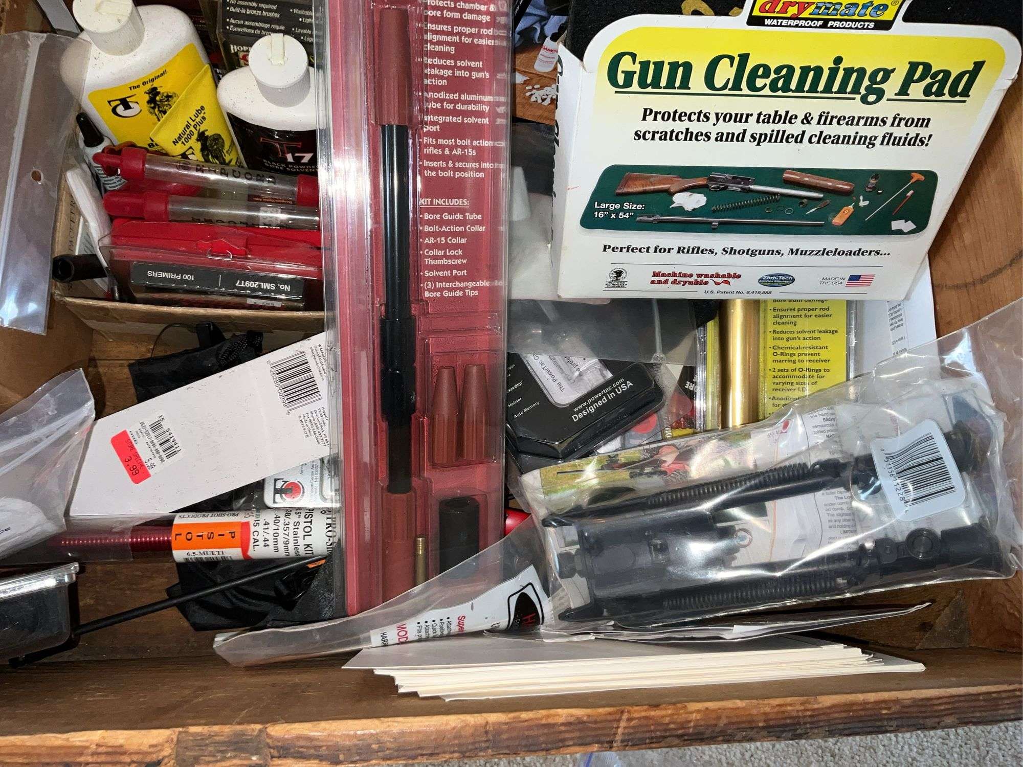 Box loaded with muzzleloader, accessories, and gun cleaning items ...