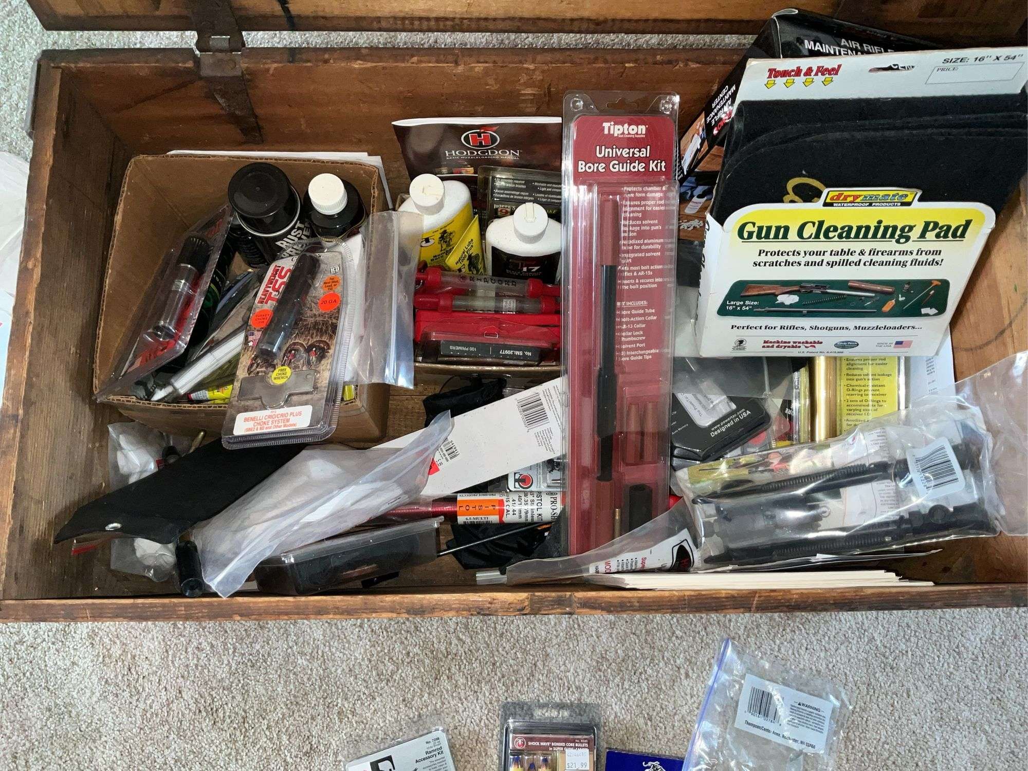 Box loaded with muzzleloader, accessories, and gun cleaning items ...