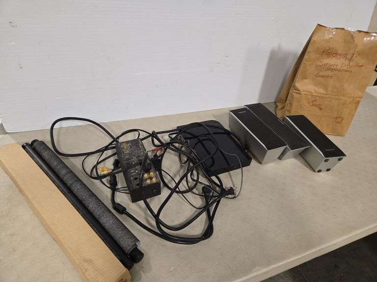 Samsung disc player, Panasonic speakers, power surge suppressor ...