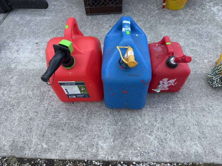 3 fuel cans 1 gas can 5 gal, 1 kerosene can 5 gal. One gas can 2 gal - Kaufman Realty & Auctions