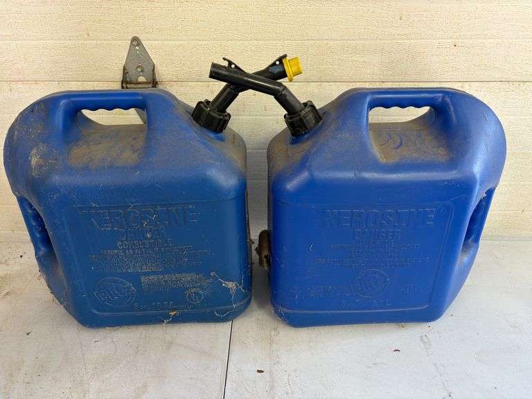 2-5 gal kerosene cans and two gas cans - Kaufman Realty & Auctions