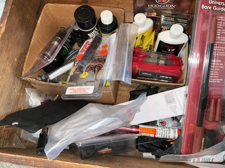 Box loaded with muzzleloader, accessories, and gun cleaning items ...