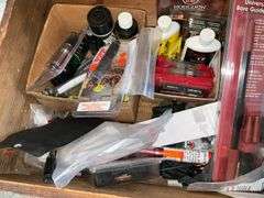 Box loaded with muzzleloader, accessories, and gun cleaning items ...
