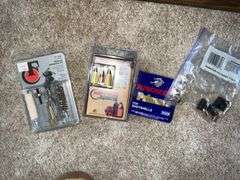 Box loaded with muzzleloader, accessories, and gun cleaning items ...