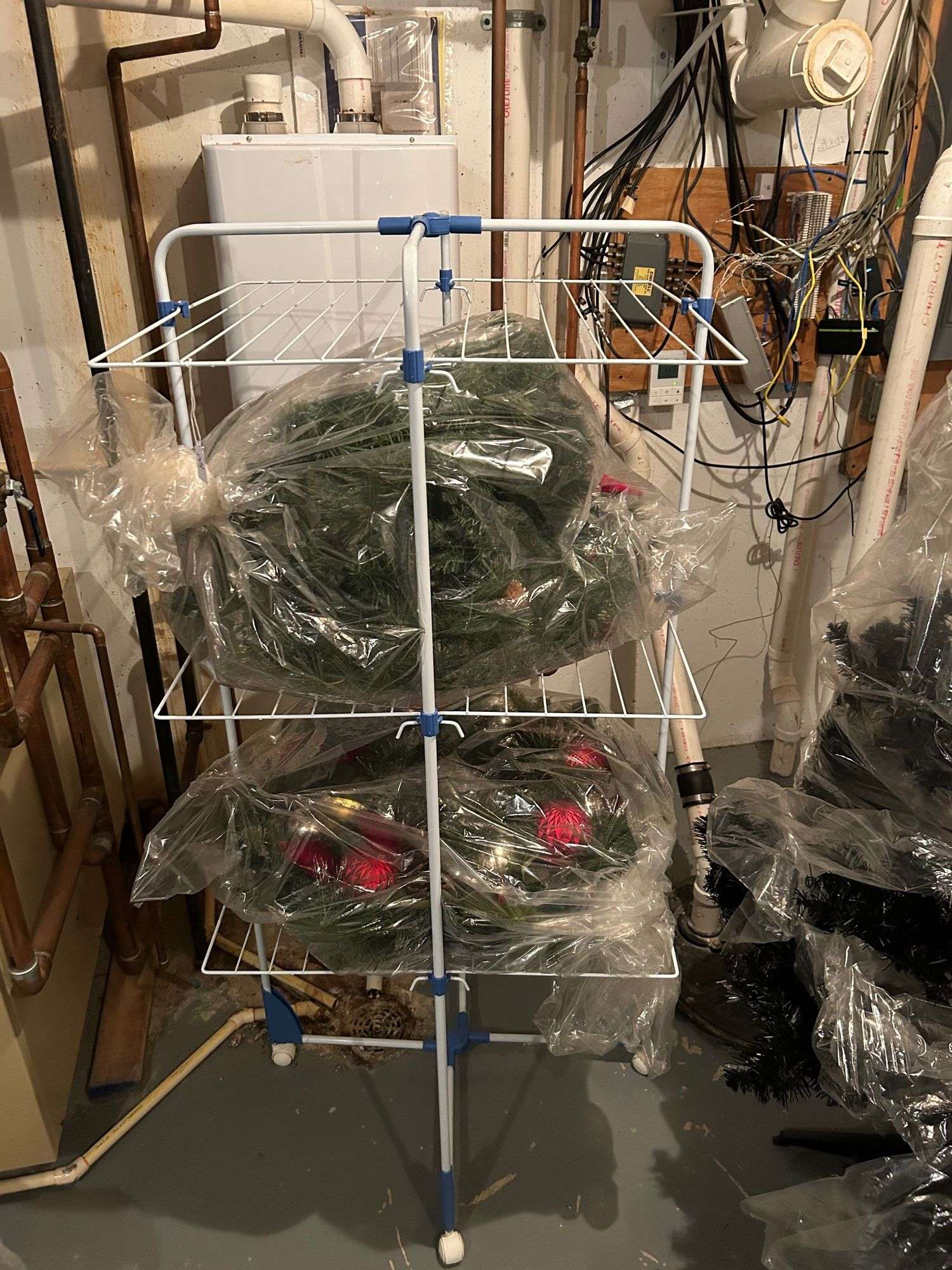 Wire shelving on rollers, Christmas wreaths and Christmas trees ...