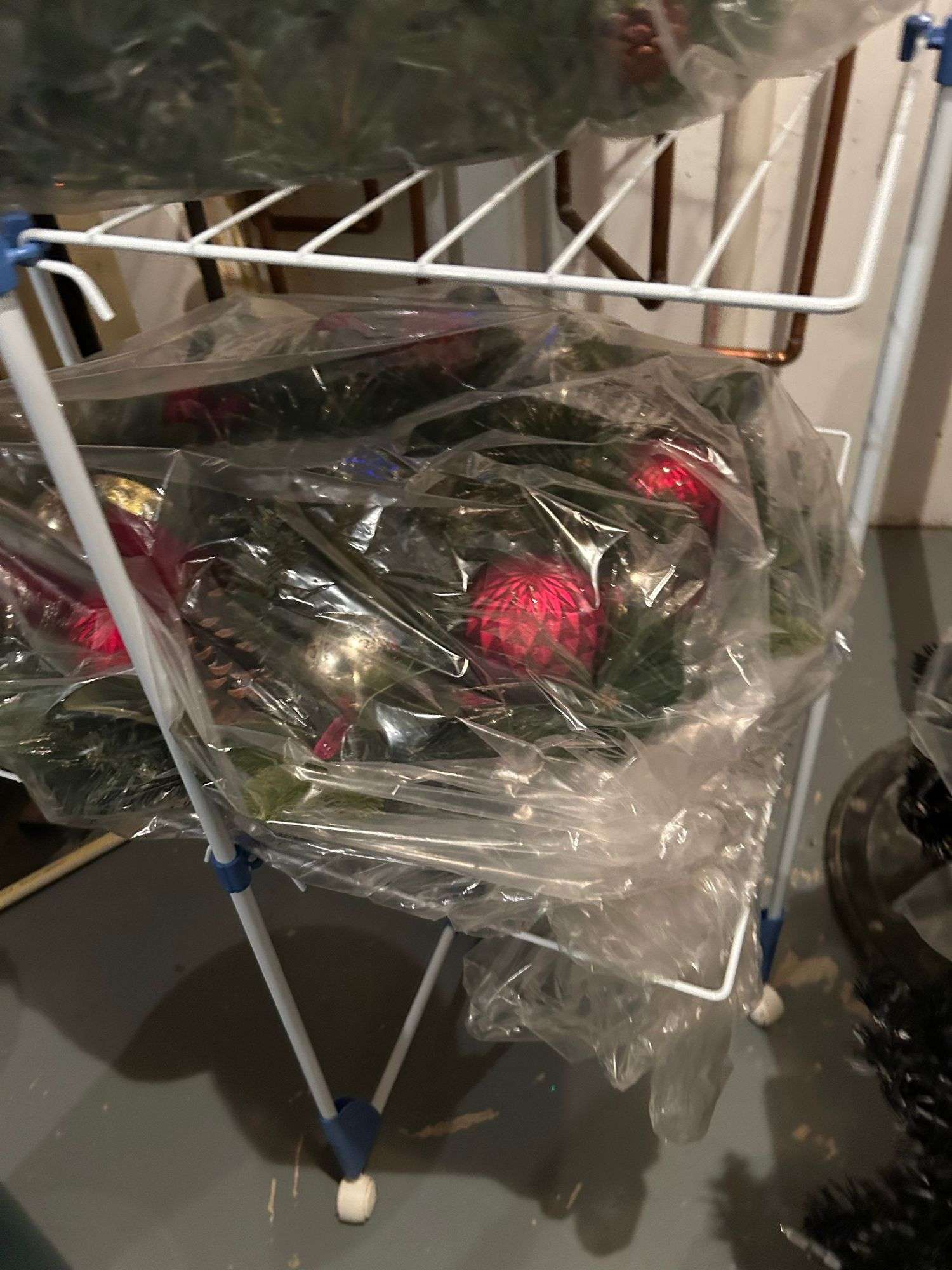 Wire shelving on rollers, Christmas wreaths and Christmas trees ...