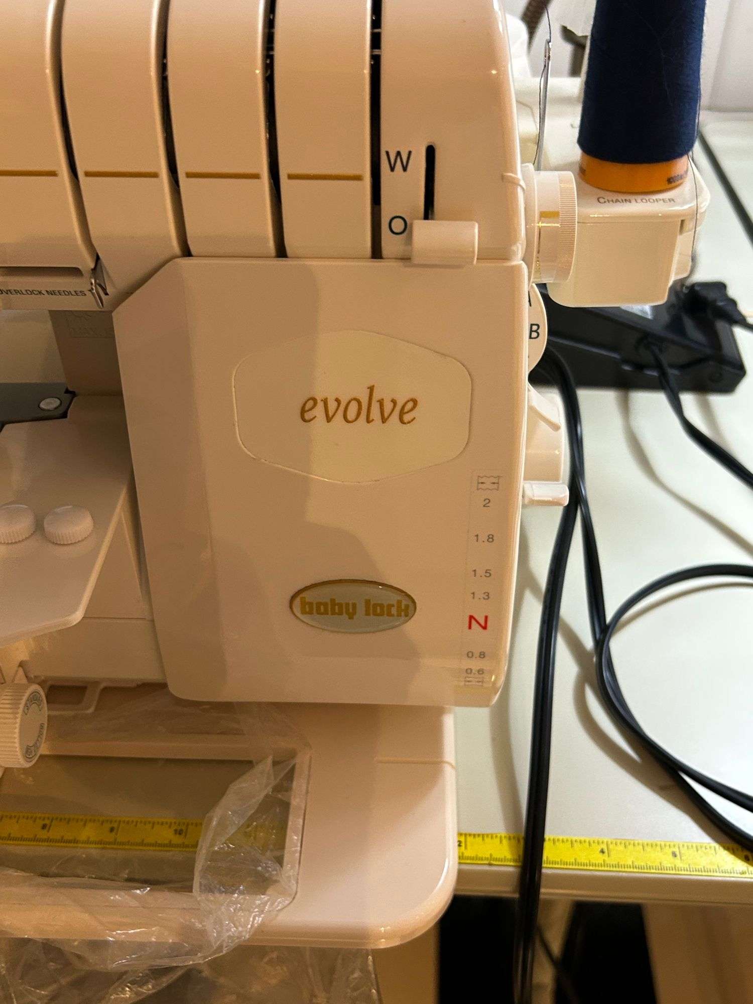 Baby Lock Evolve BLE-2. This is an 8-thread machine combining chain and ...