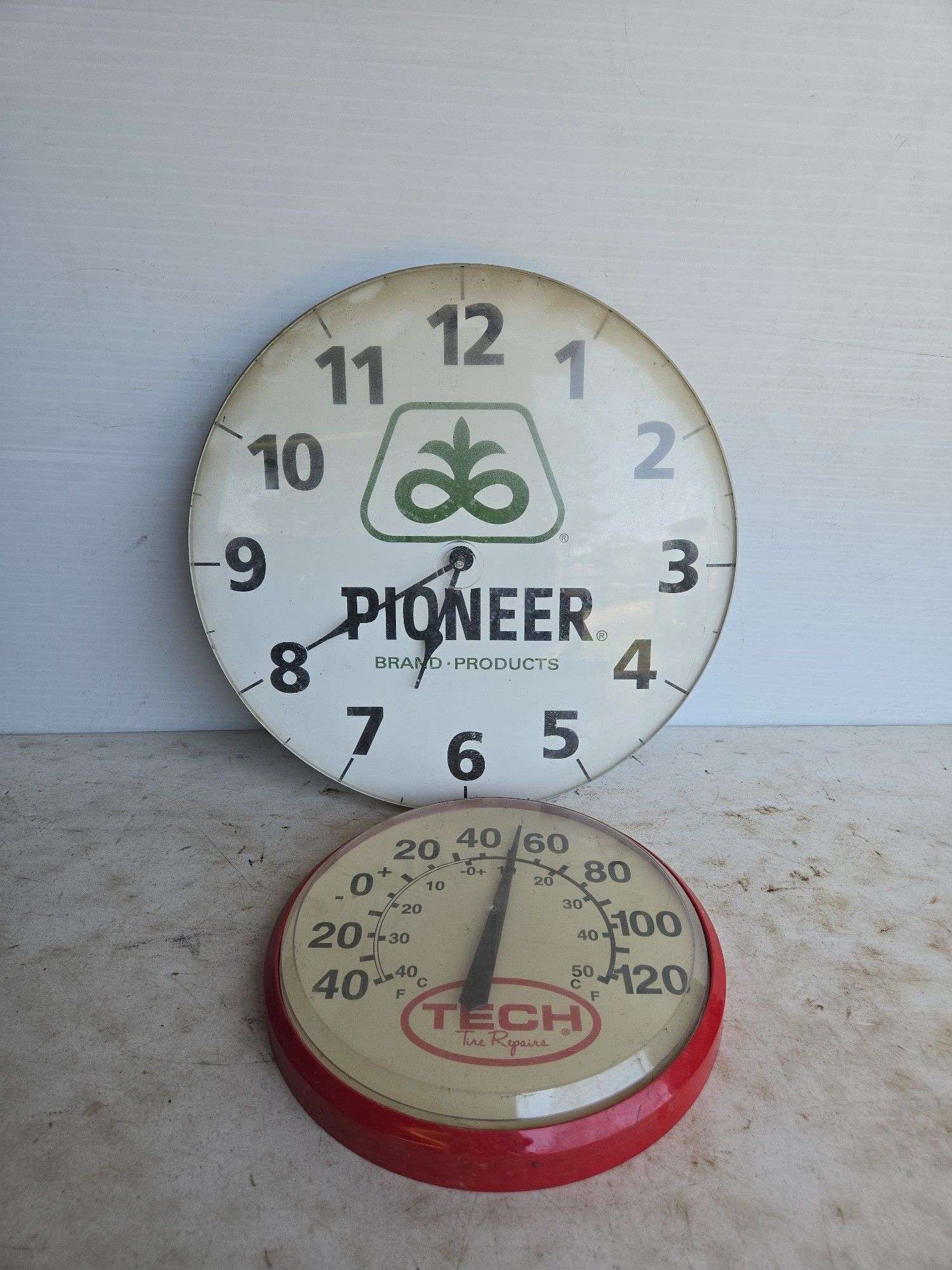 Pioneer clock- 18"D & Tech thermometer - Kaufman Realty & Auctions