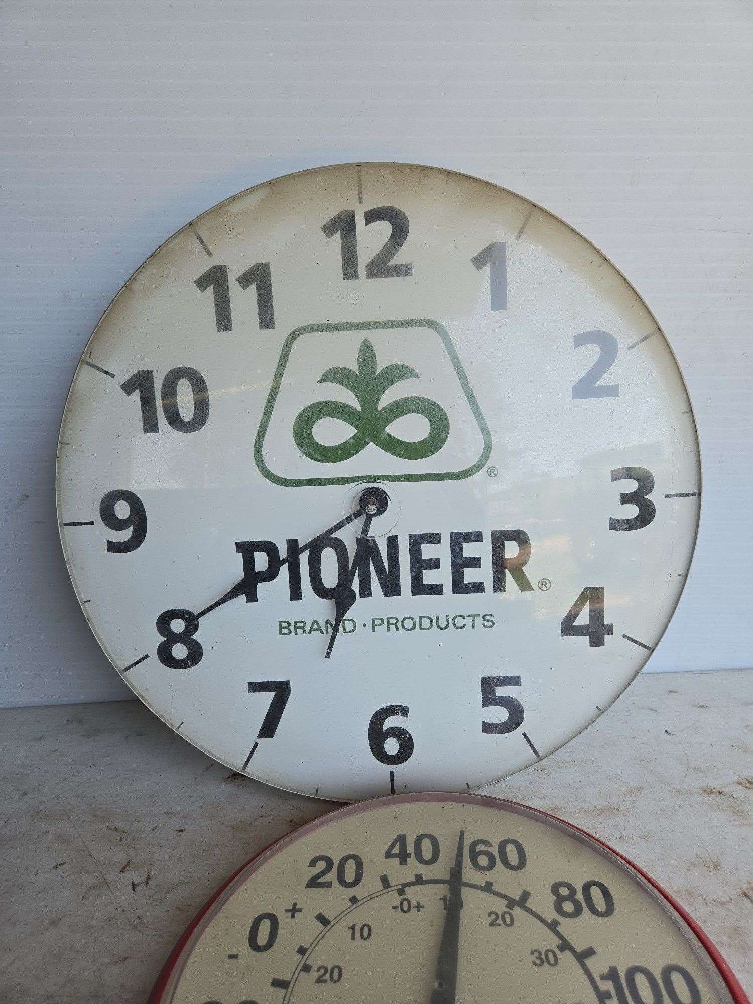 Pioneer clock- 18"D & Tech thermometer - Kaufman Realty & Auctions