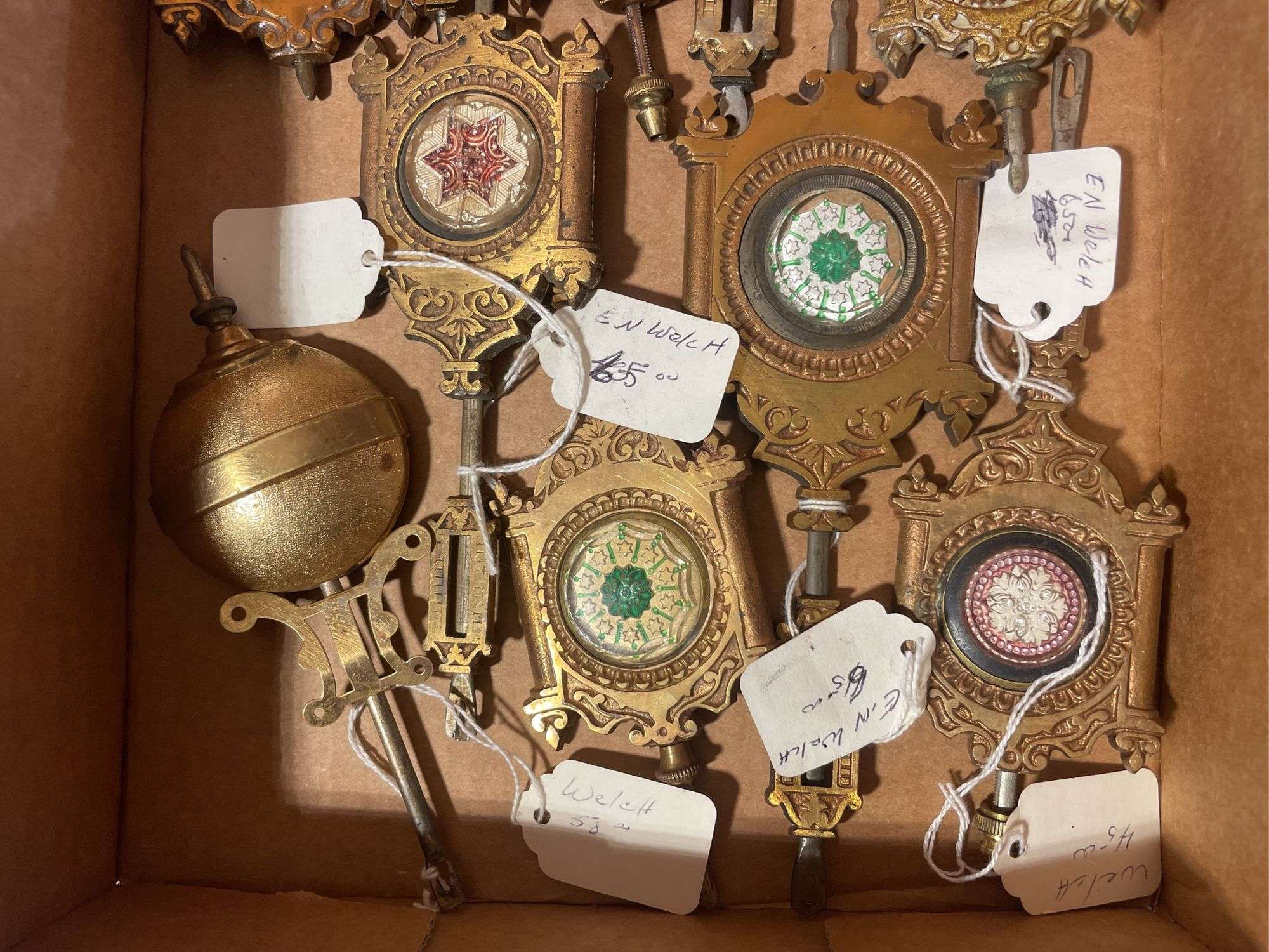 (14) Welch pendulums/bobs - Kaufman Realty & Auctions