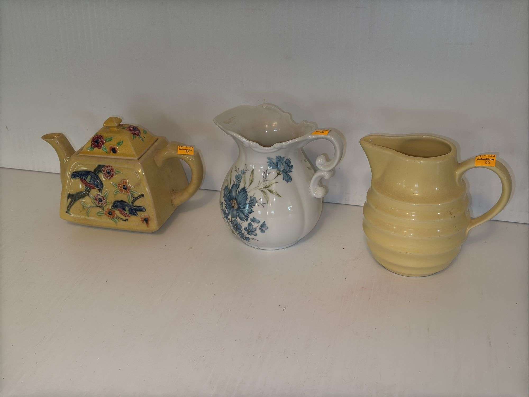 (3) Pottery Pitchers - Kaufman Realty & Auctions