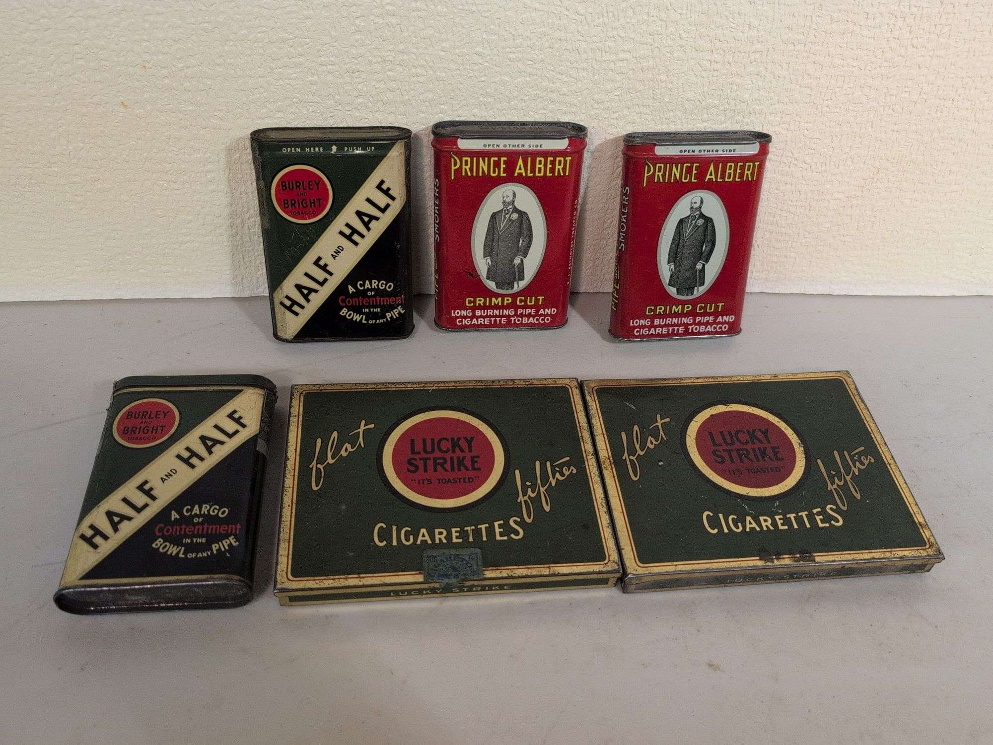 Prince Albert, Burley and Bright, and Lucky Strike tobacco tins ...