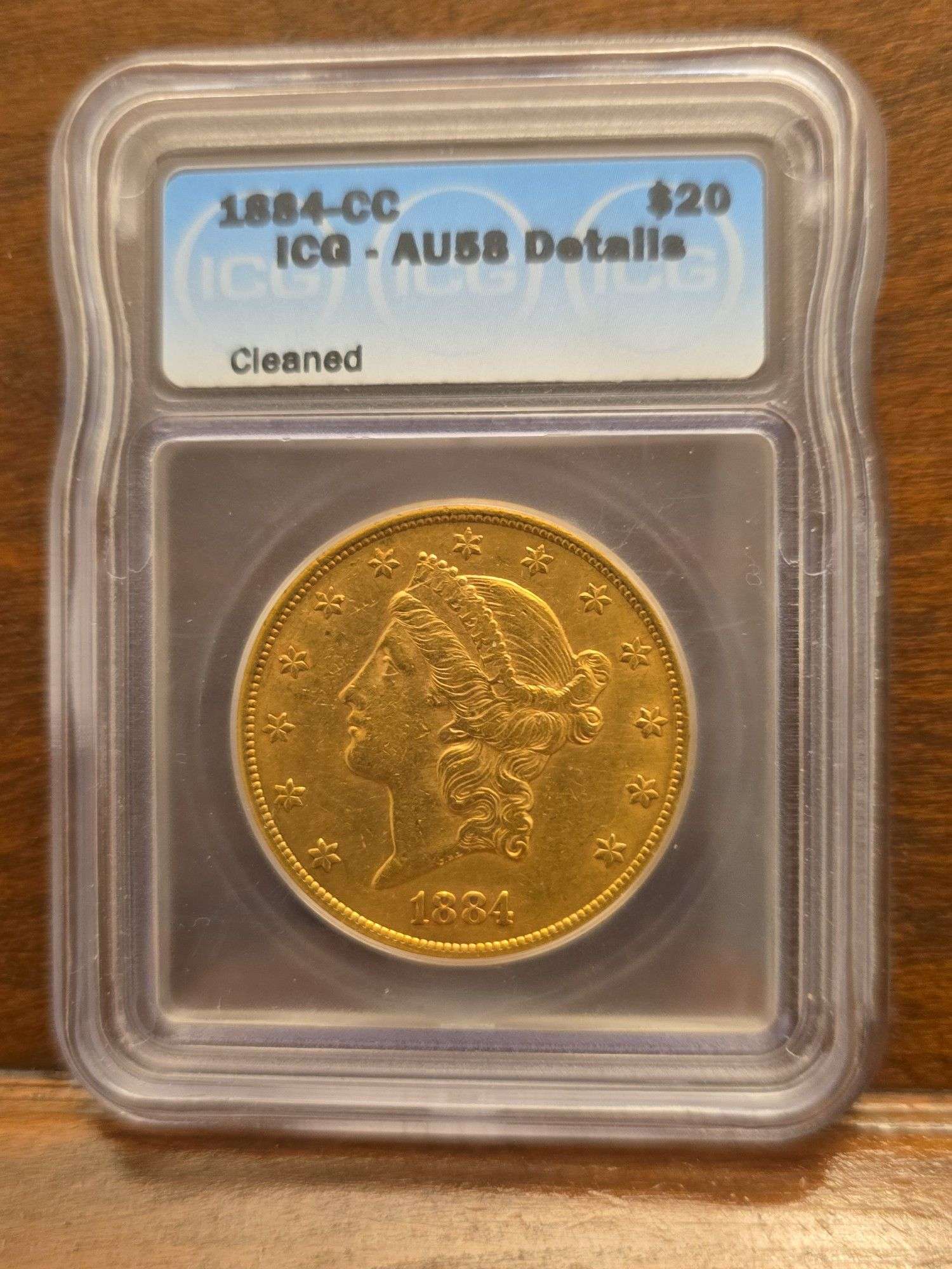 1884CC $20. LIBERTY HEAD GOLD PIECE ICG AU58 DETAILS CLEANED - Kaufman Realty & Auctions