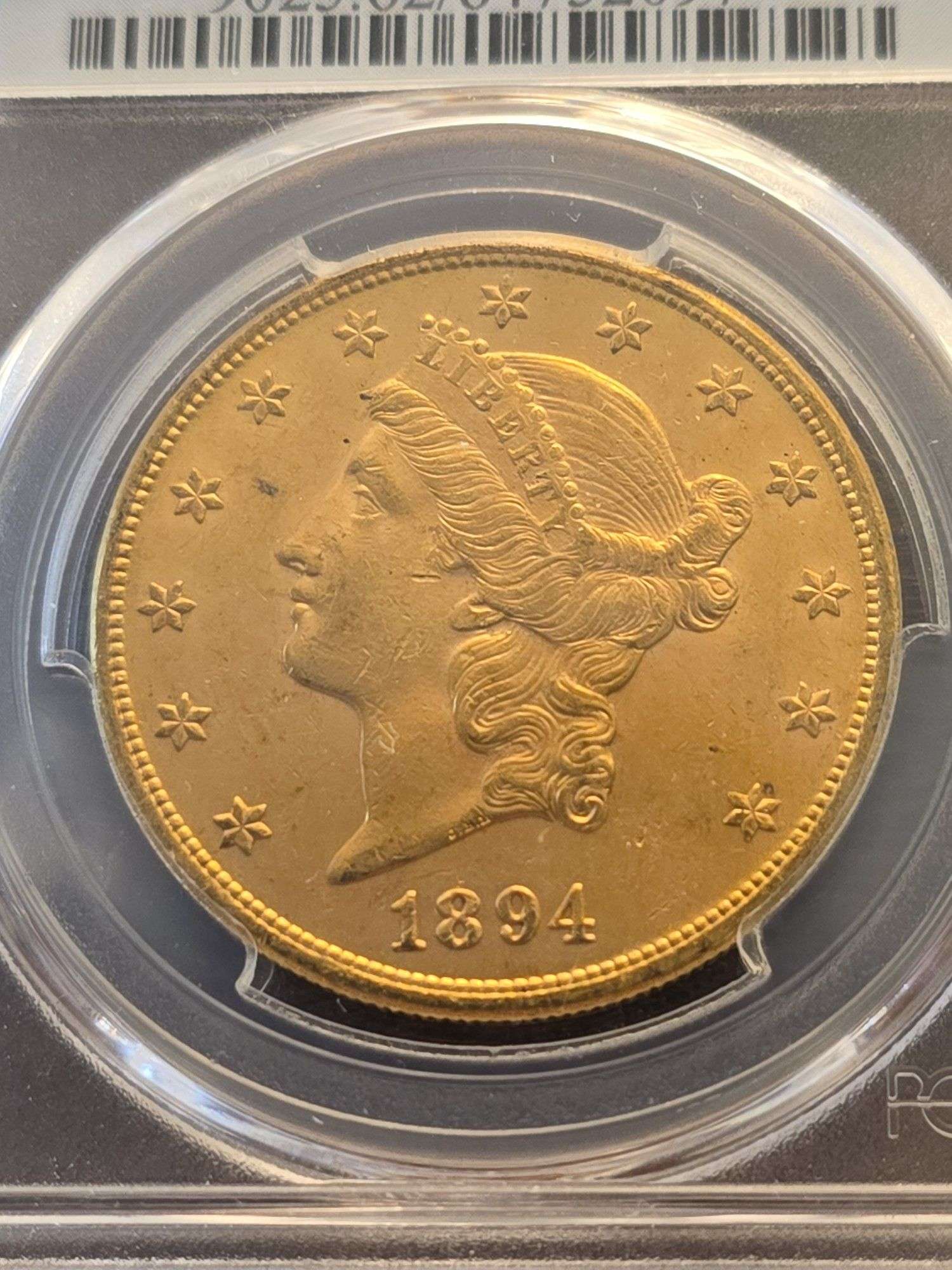 1894 $20. LIBERTY HEAD GOLD PIECE PCGS MS62 - Kaufman Realty & Auctions