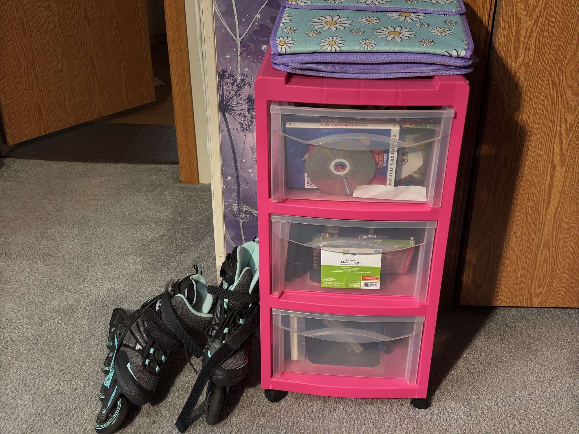 Plastic 3-drawer cart organizer with DVDs, folder & roller blades ...