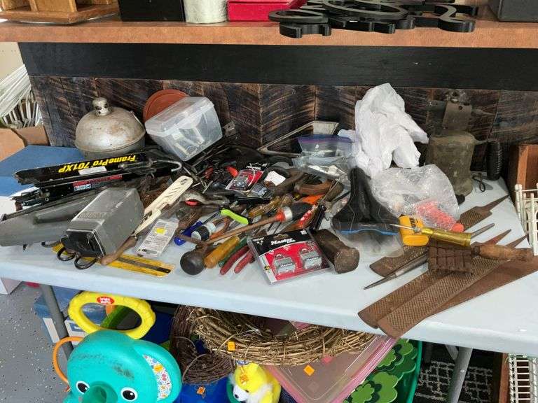 Tools on table, nailer, antique flare, locks - Kaufman Realty & Auctions